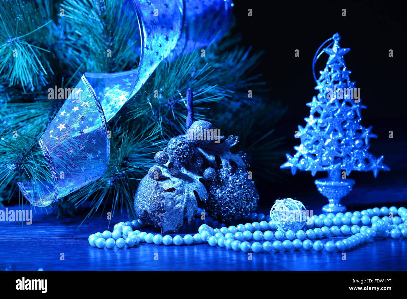 Beautiful Decorated Christmas tree on a darl background Stock Photo - Alamy