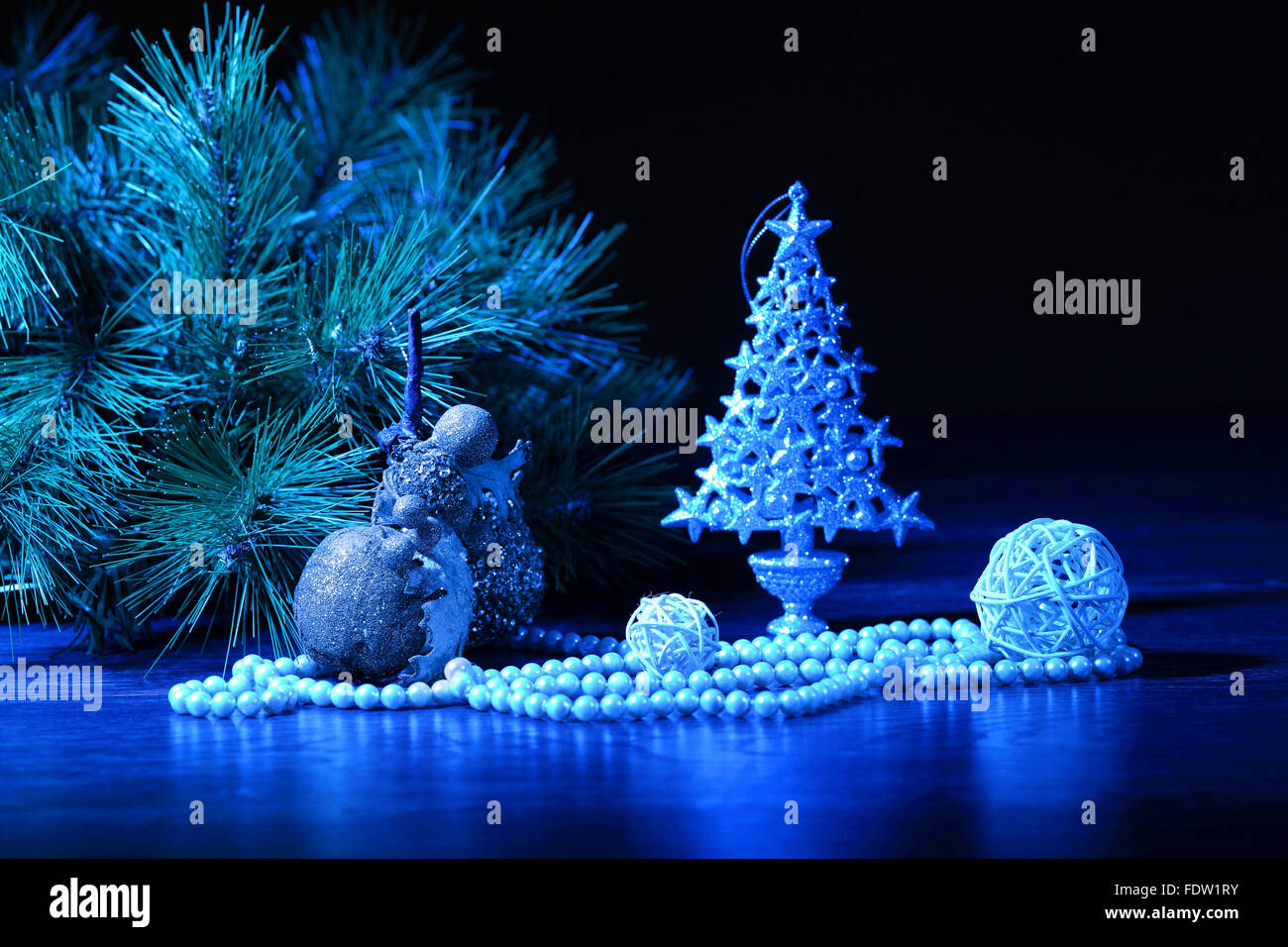 Beautiful Decorated Christmas tree on a darl background Stock Photo - Alamy