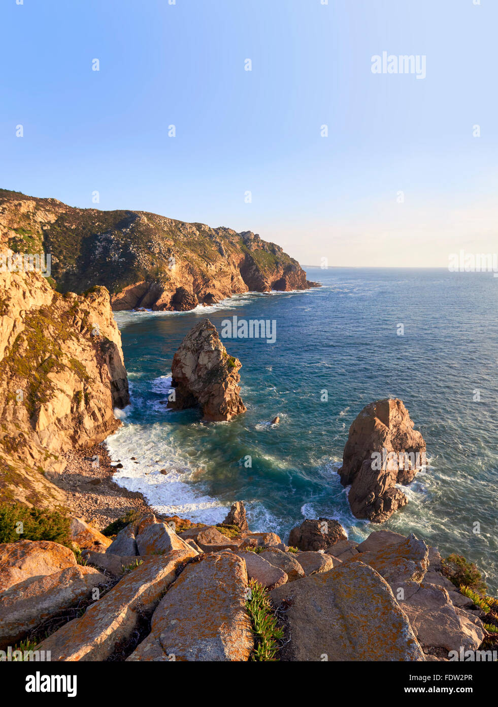 Rocks of Cabo da Roca coast in the ocean landscape in warm light Stock ...