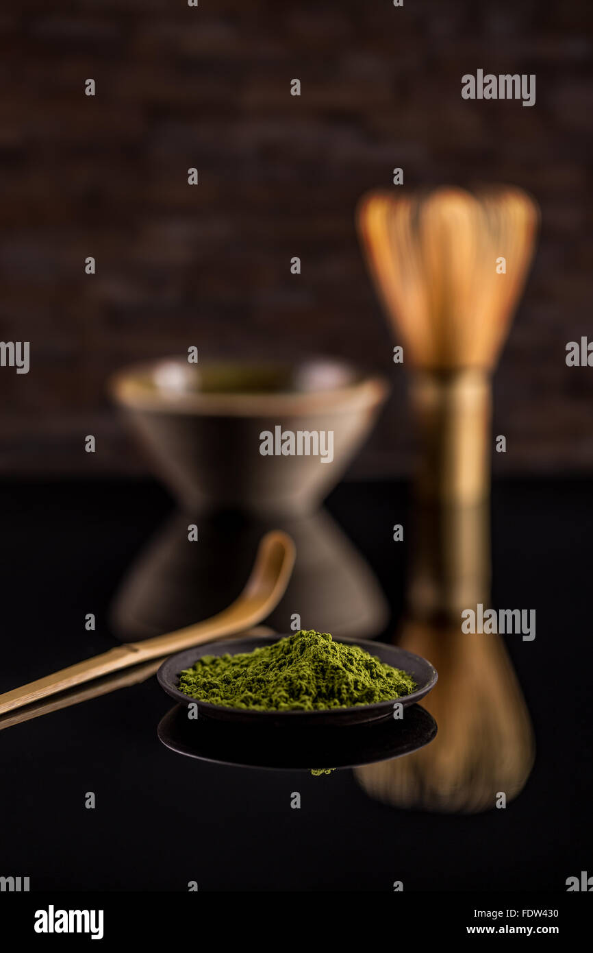 Japanese matcha green tea powder in black plate Stock Photo - Alamy