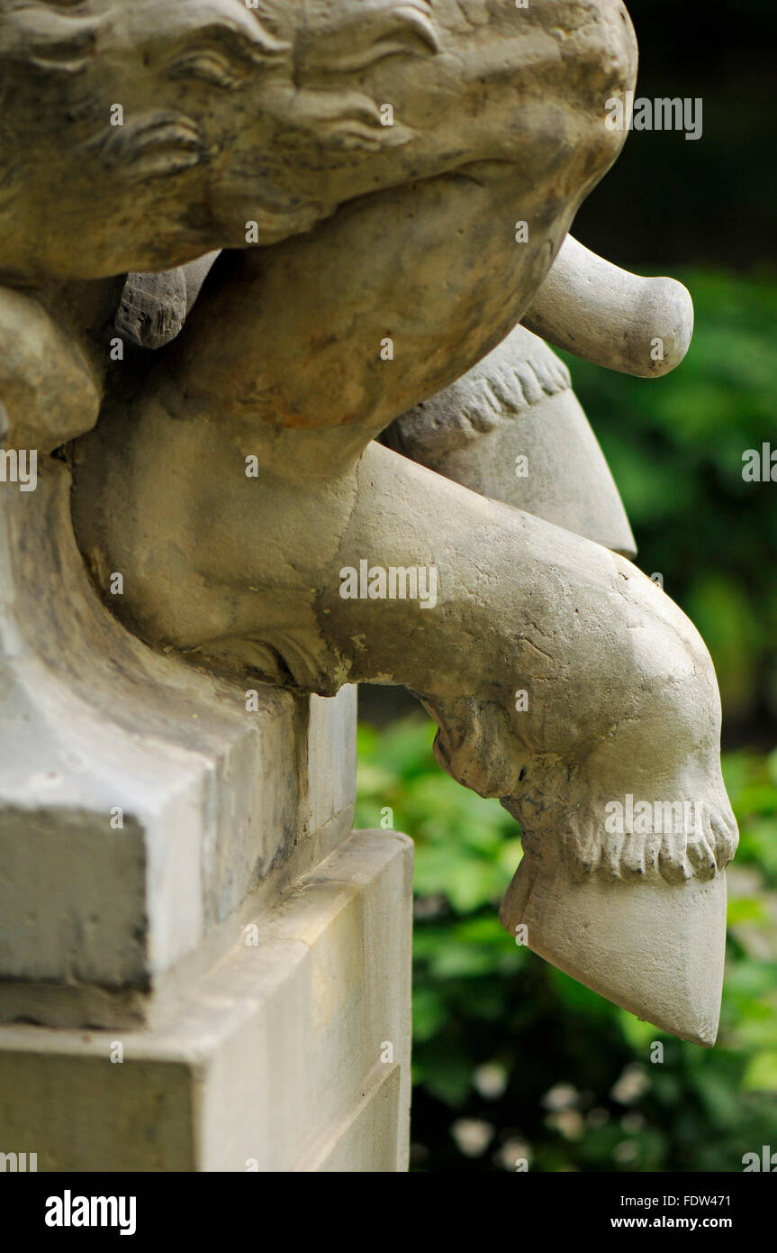 Lantern with sculpture of faun or satyr hoofs in Royal Baths Park of ...