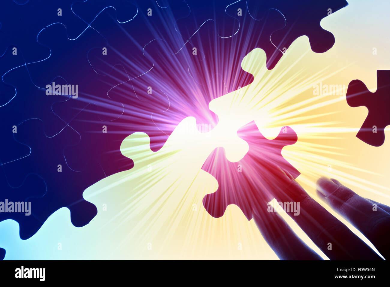 puzzle piece coming down into its place Stock Photo - Alamy