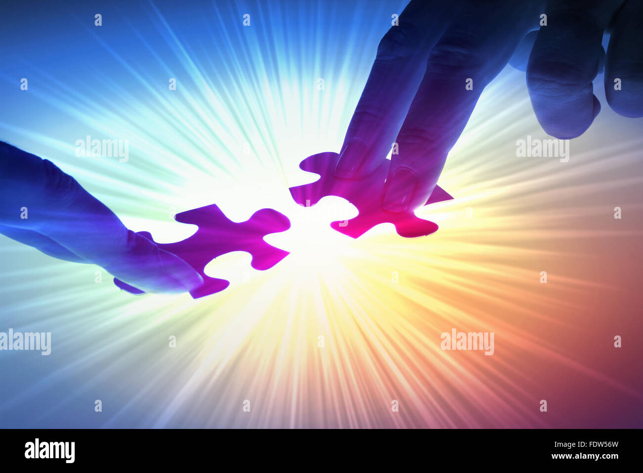 puzzle piece coming down into its place Stock Photo - Alamy