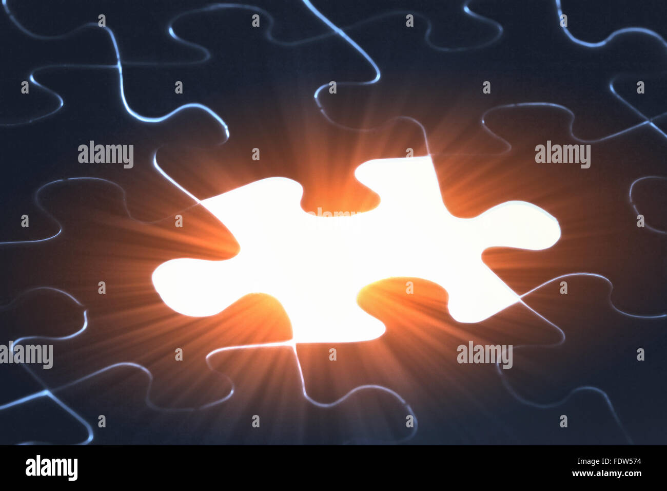 puzzle piece coming down into its place Stock Photo - Alamy