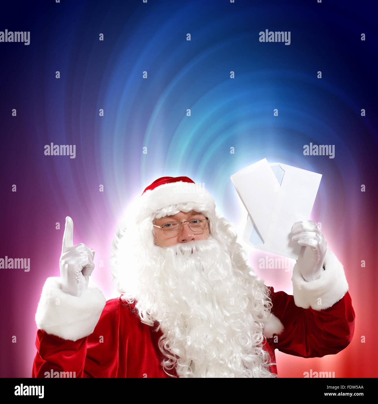 Santa holding Christmas letters and looking at camera Stock Photo - Alamy