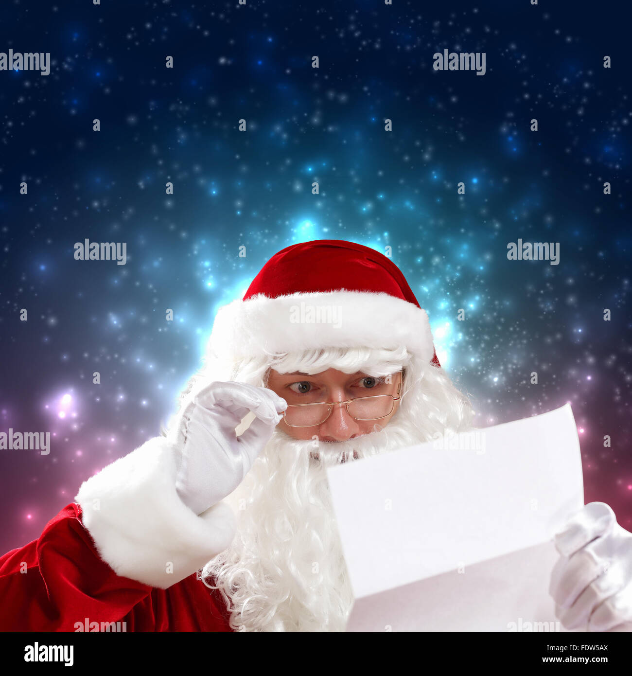 Happy santa claus reading letters hi-res stock photography and images ...