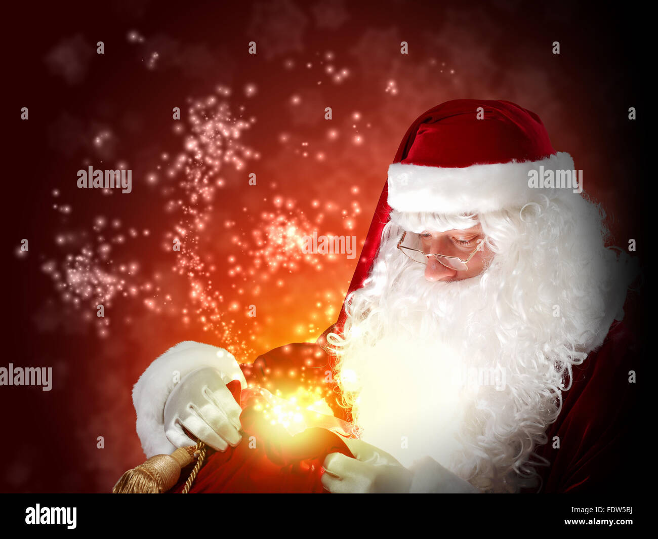 father Christmas carrying presents in his sack Stock Photo - Alamy