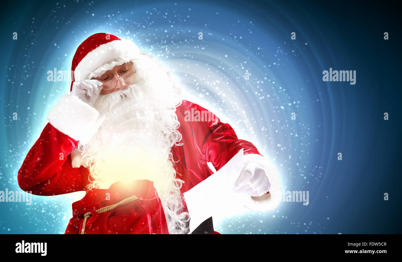 Santa holding Christmas letters and looking at camera Stock Photo - Alamy