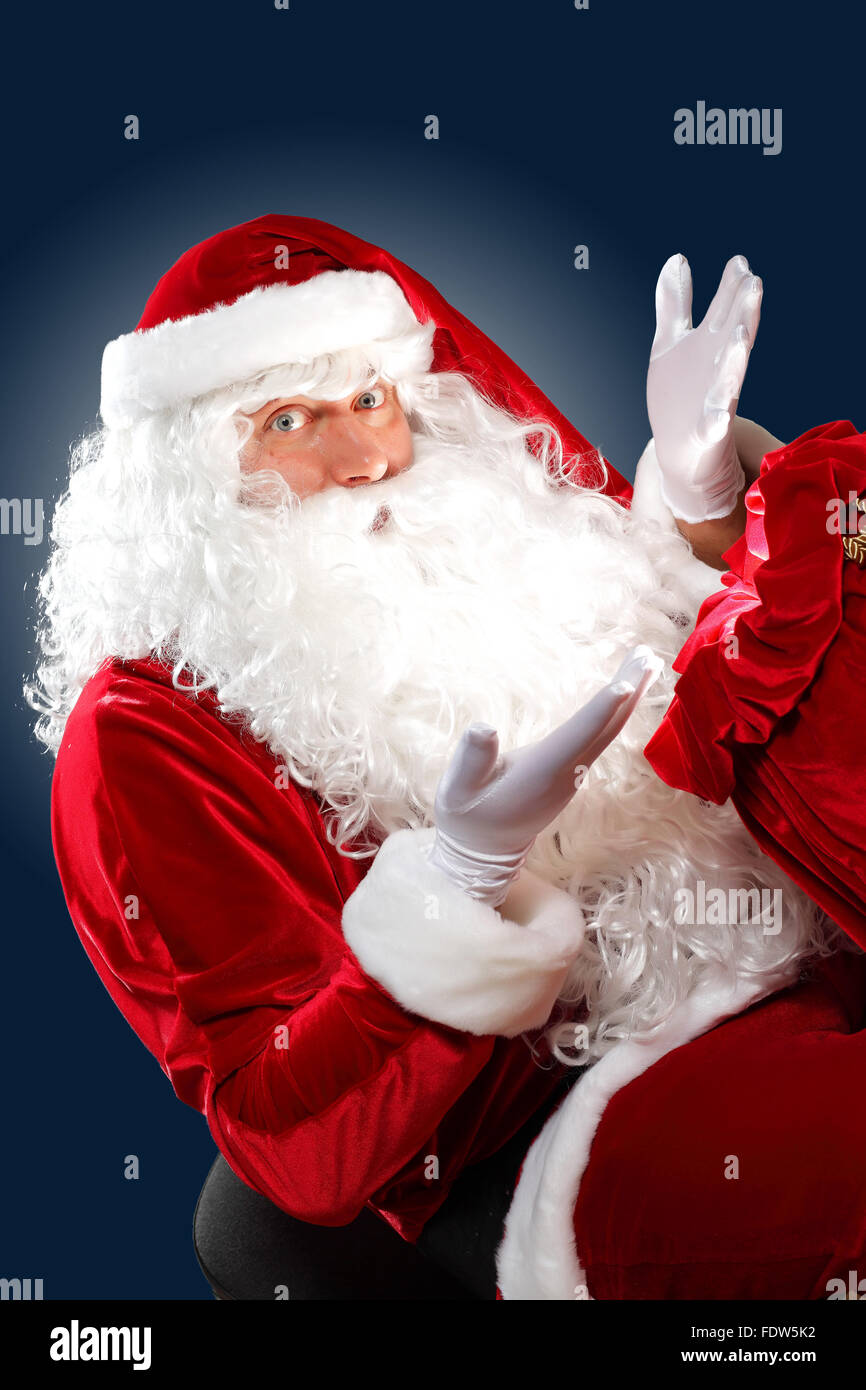 Santa Claus with his magic gift red bag full of presents Stock Photo ...