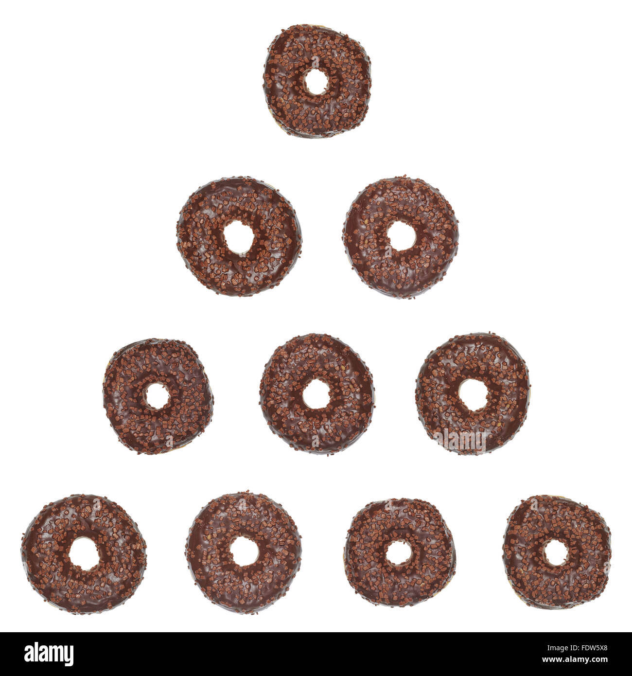 Triangle of chocolate donuts on yellow background Stock Photo - Alamy
