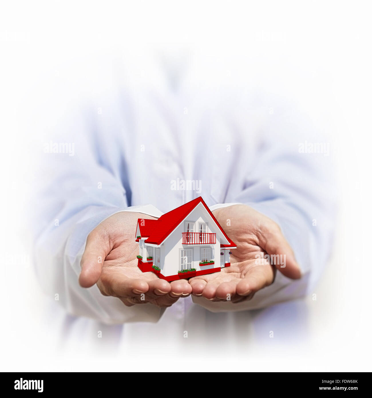 Residential building and a businessman holding it in his hands Stock ...