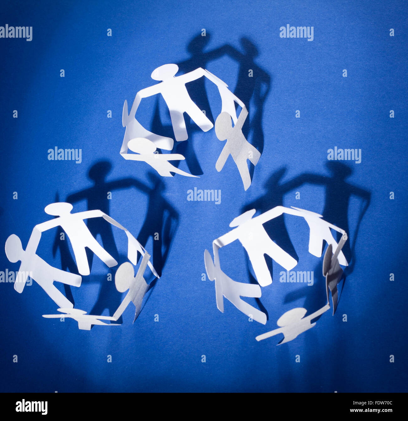 Group paper doll holding hands hi-res stock photography and images - Alamy