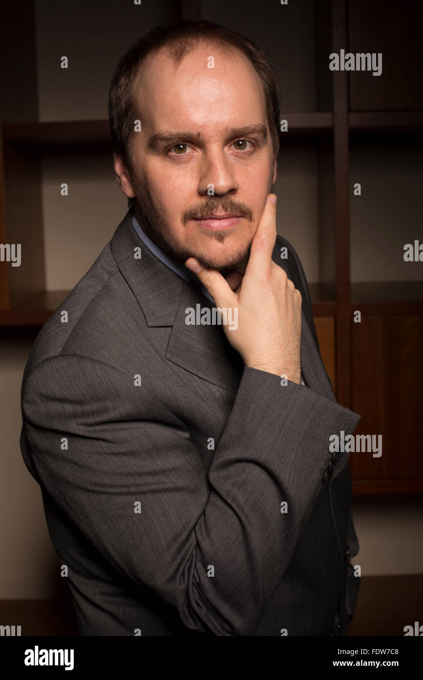 business man in home office with thoughtful look Stock Photo - Alamy