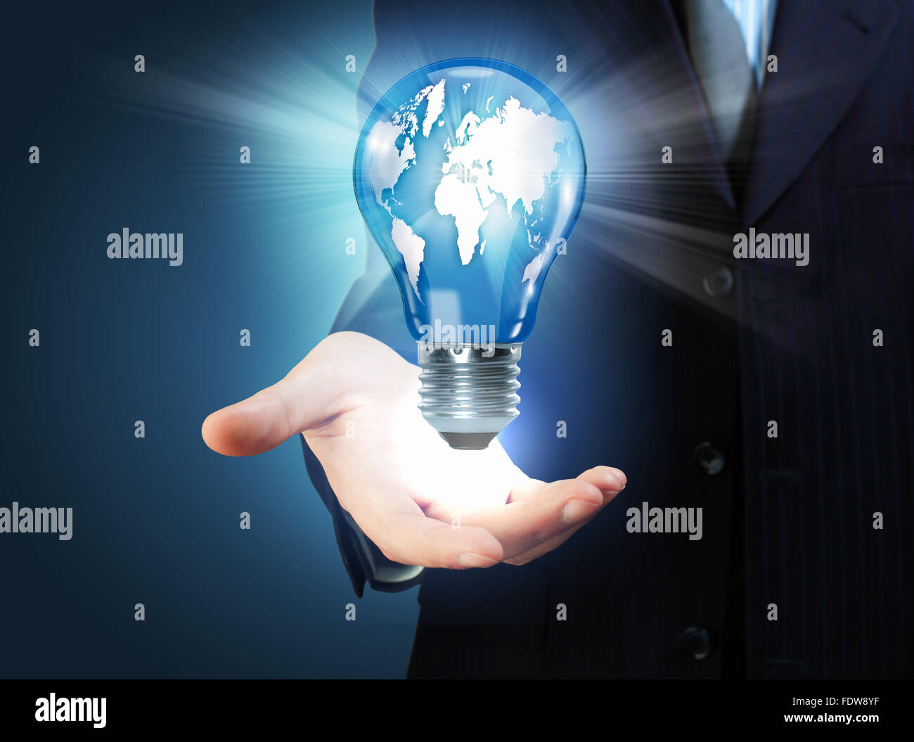Hand with lamp and hands of a business person Stock Photo - Alamy
