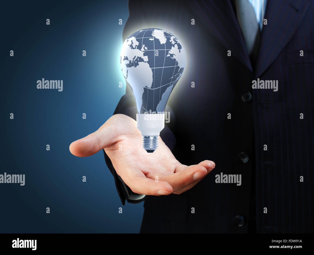 Hand with lamp and hands of a business person Stock Photo - Alamy