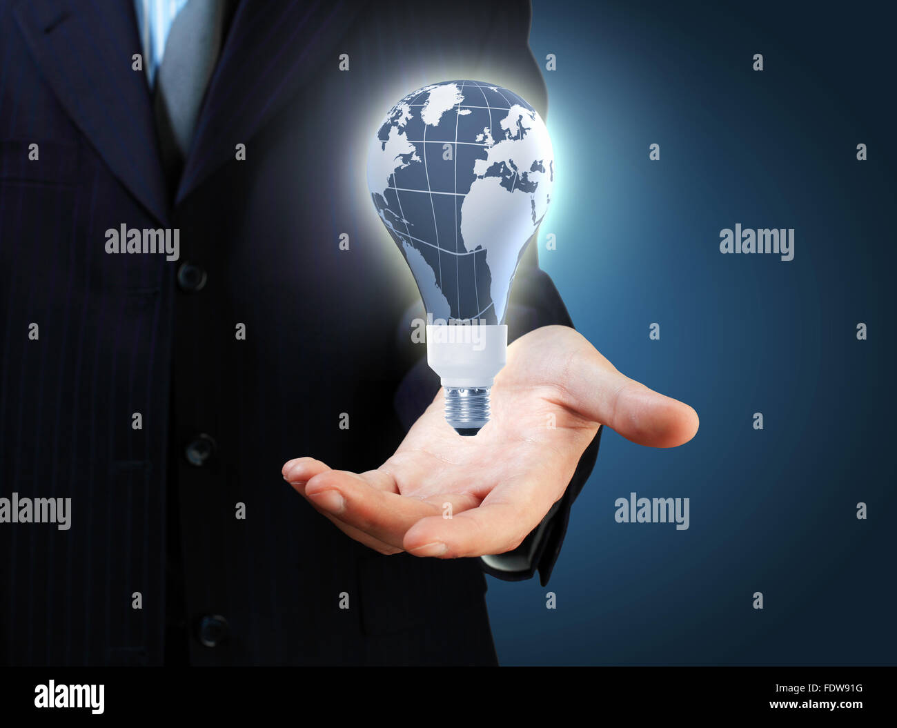 Hand with lamp and hands of a business person Stock Photo - Alamy