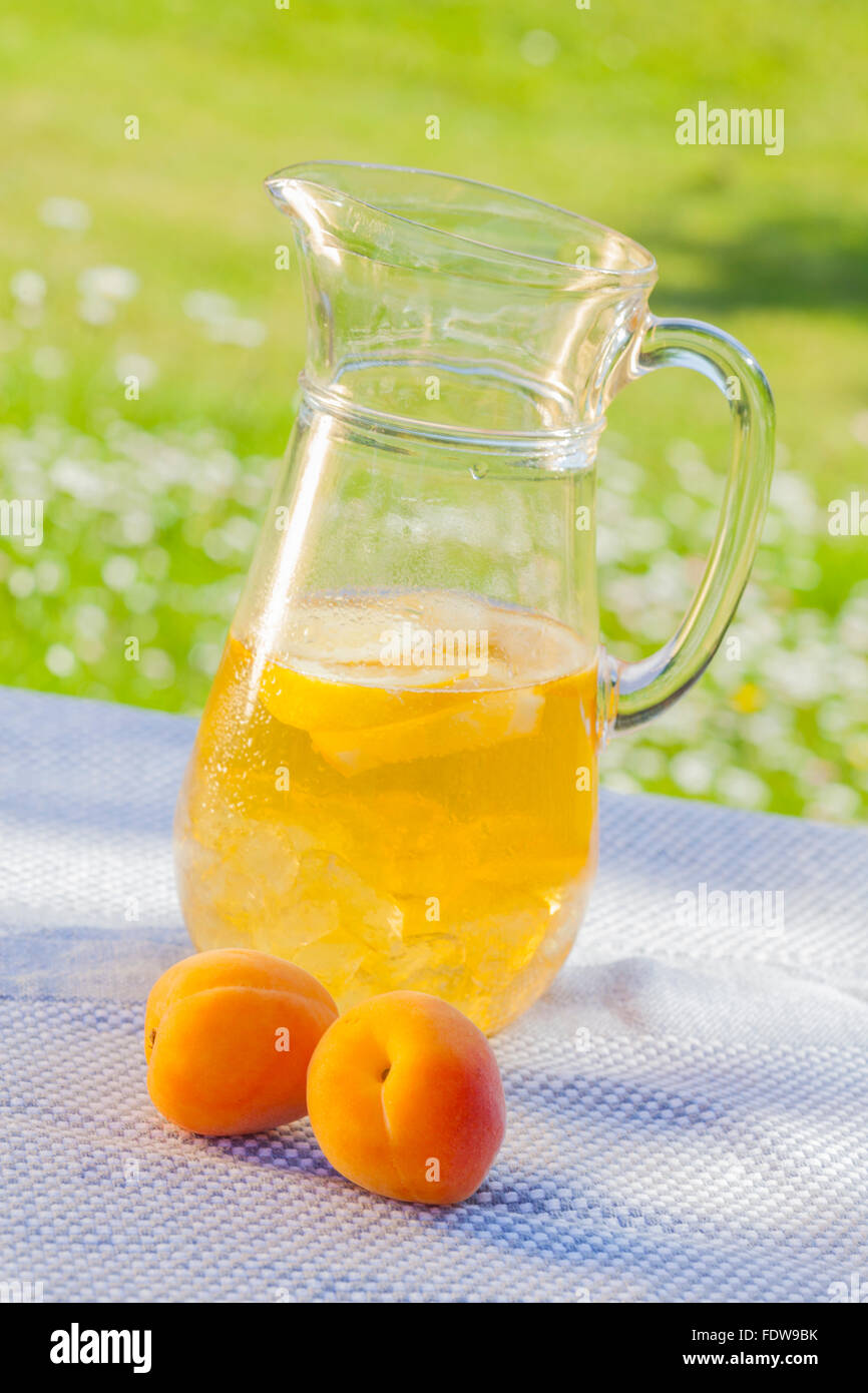 home made cold peach ice tea in summer garden Stock Photo - Alamy