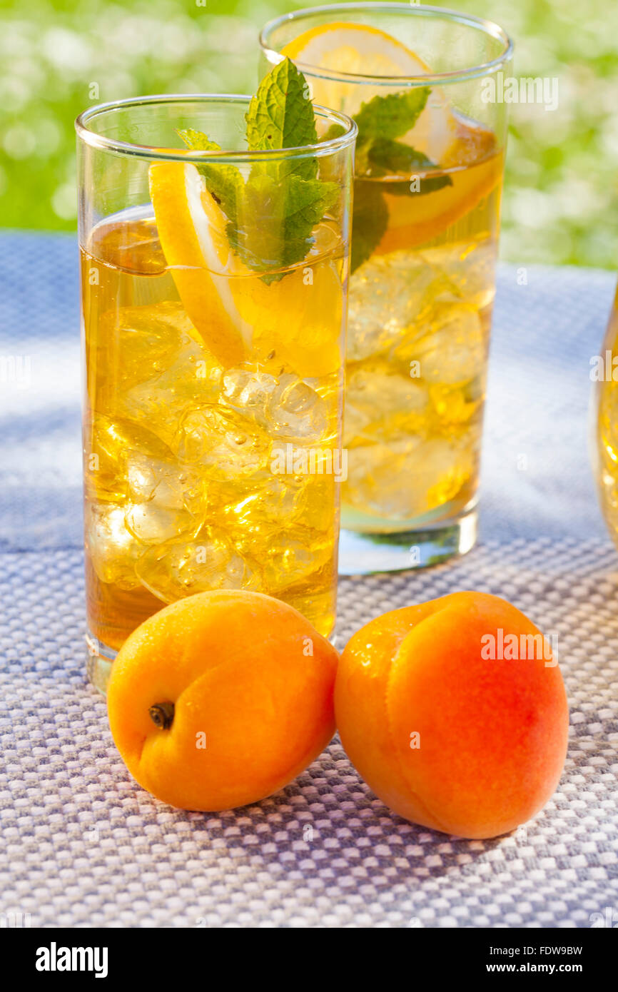 home made cold peach ice tea in summer garden Stock Photo - Alamy