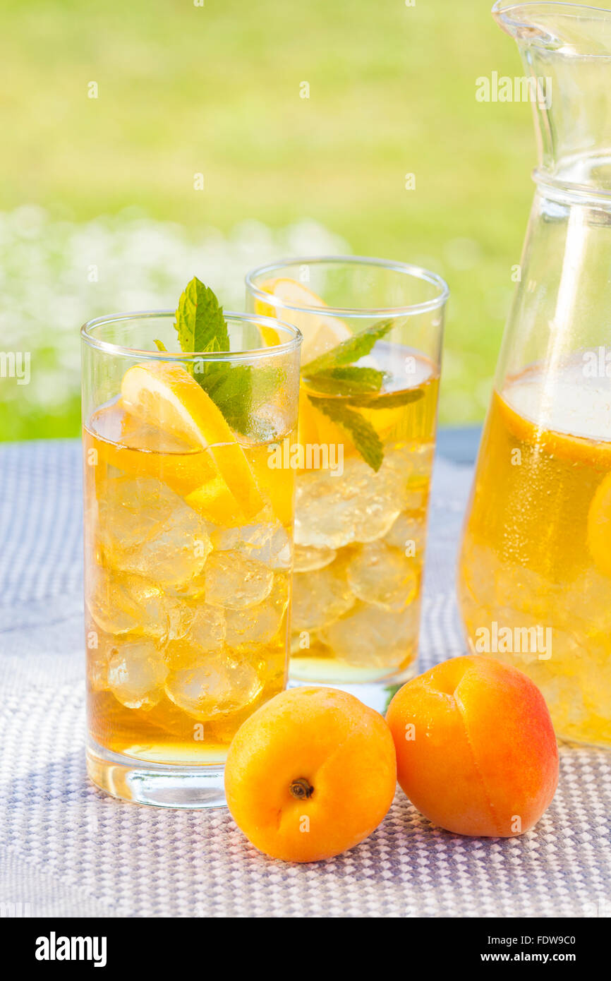 home made cold peach ice tea in summer garden Stock Photo - Alamy
