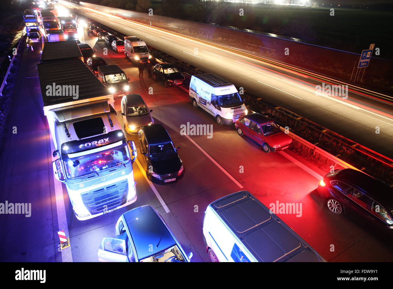 Trucks and cars queue during a traffic jam on the A9 motorway near ...