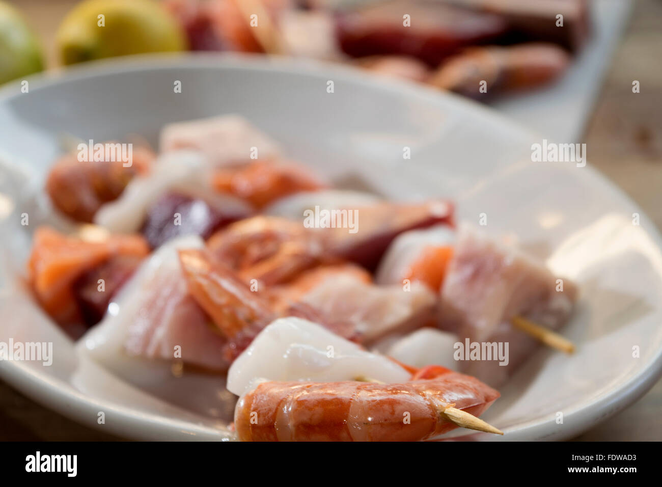 tuna swordfish salmon and prawns for making fresh fish skewers Stock ...