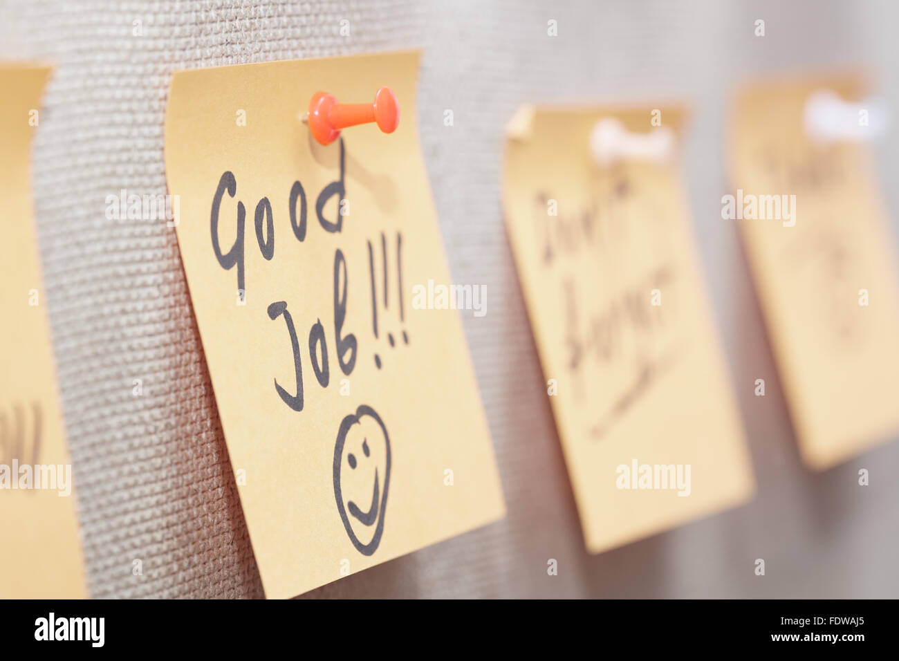 Adhesive note with Good Job text on a cork bulletin board Stock Photo ...