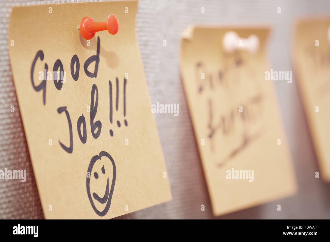 Adhesive note with Good Job text on a cork bulletin board Stock Photo ...