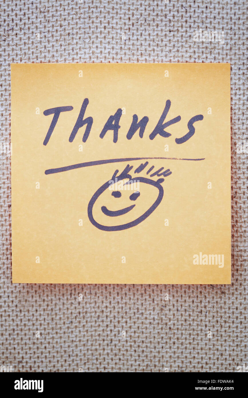 Adhesive note with Thanks text on a bulletin board Stock Photo - Alamy