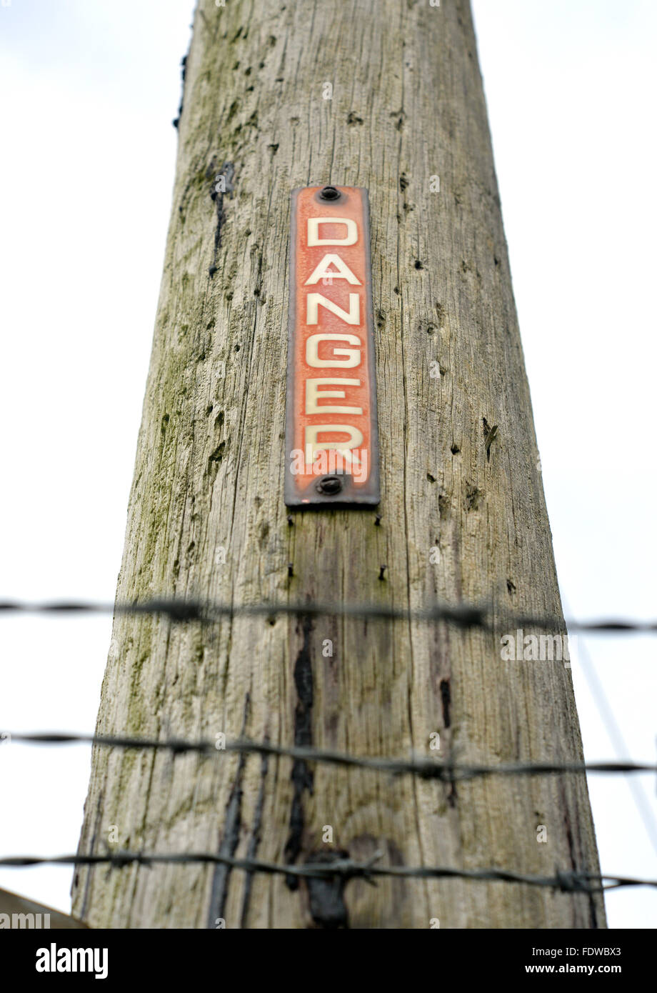 Vintage danger sign on electricity pole Stock Photo - Alamy