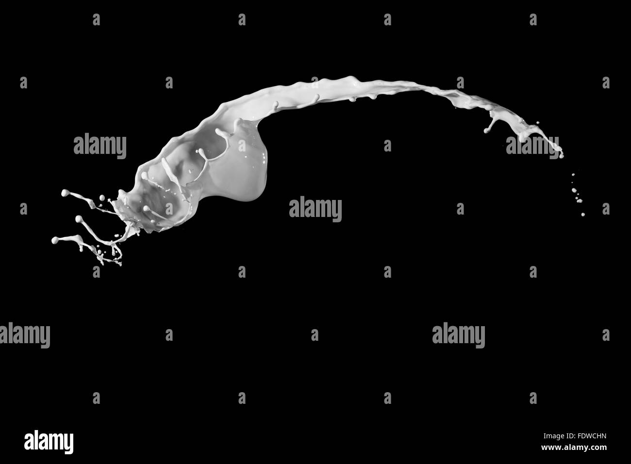 White milk splash isolated on black background Stock Photo - Alamy