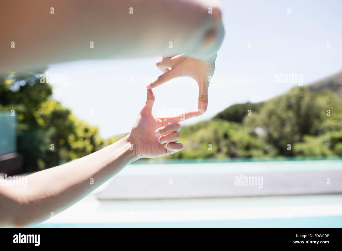 Woman making square with hands Stock Photo - Alamy