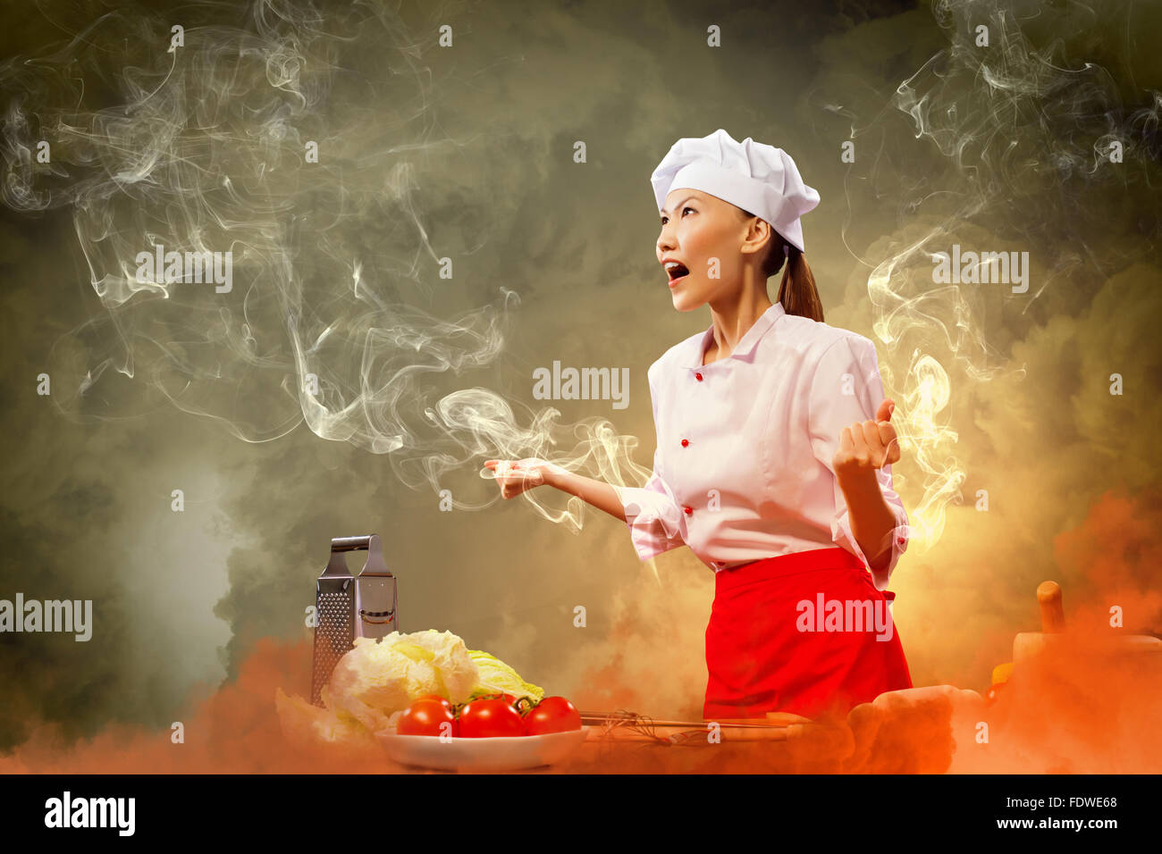 Asian female cook in anger against color background with shine effects ...