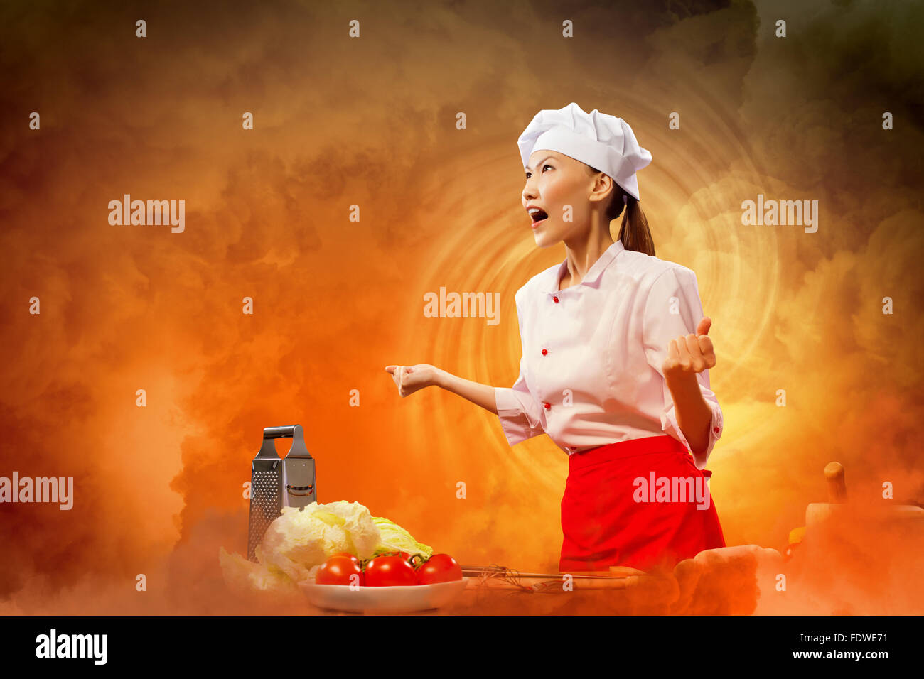 Asian female cook in anger against color background with shine effects ...