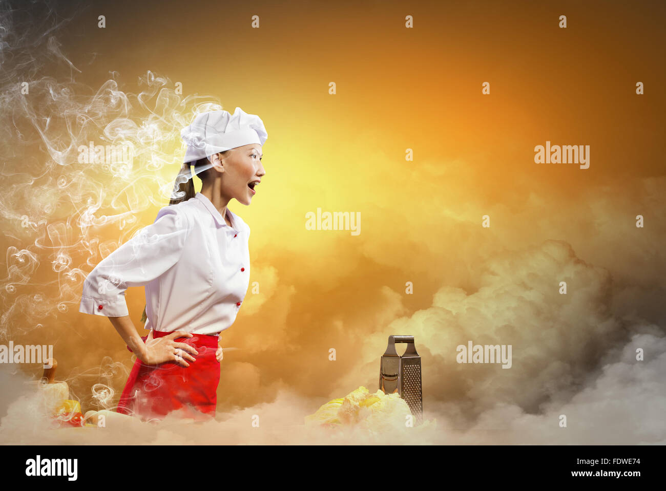 Asian female cook in anger against color background with shine effects ...