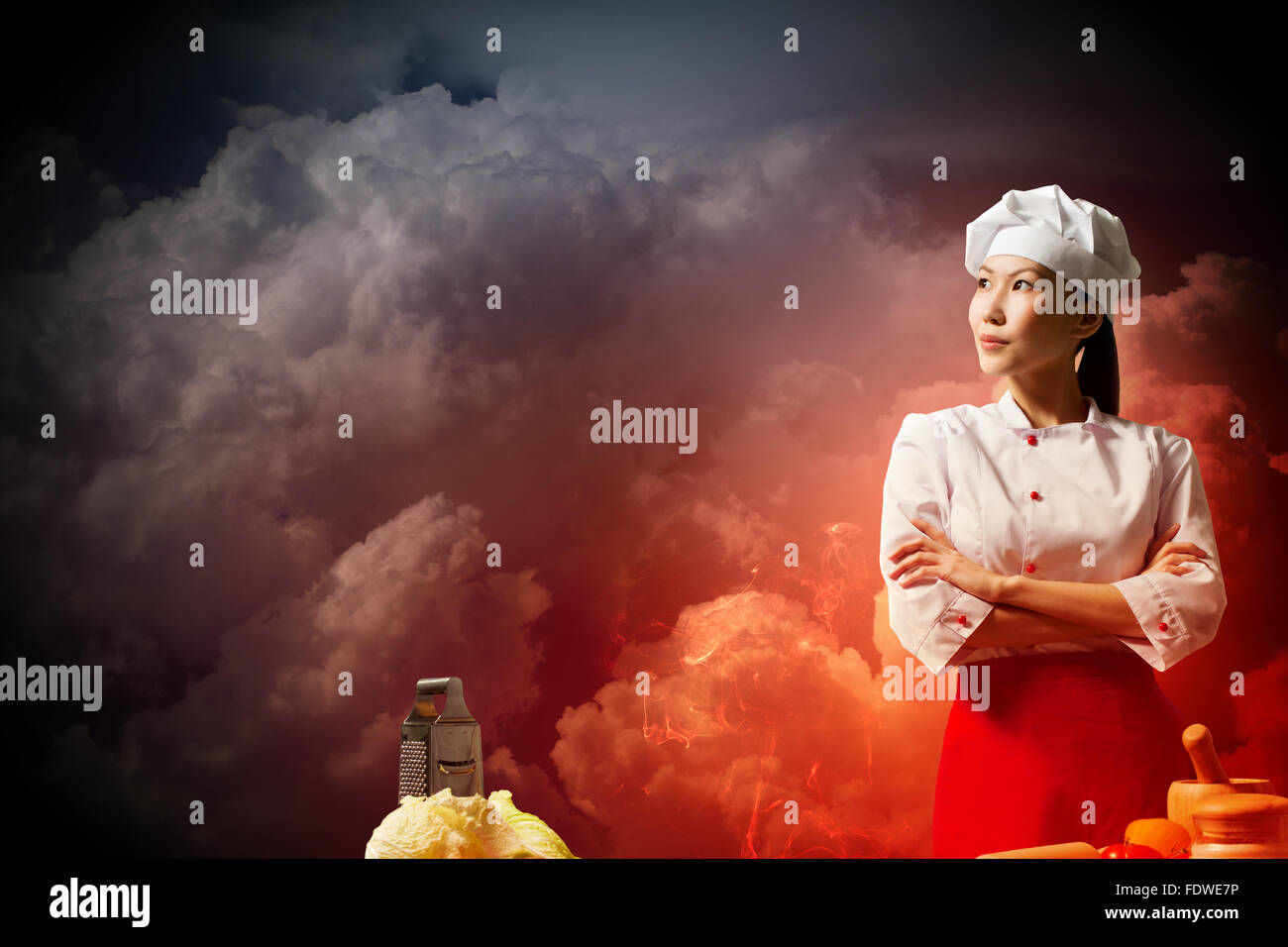 Asian female cook in anger against color background with shine effects ...