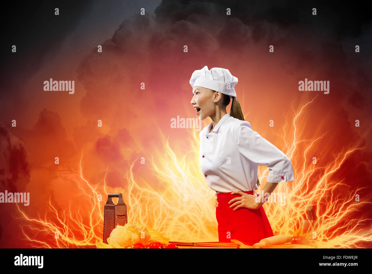 Asian female cook in anger against color background with shine effects ...