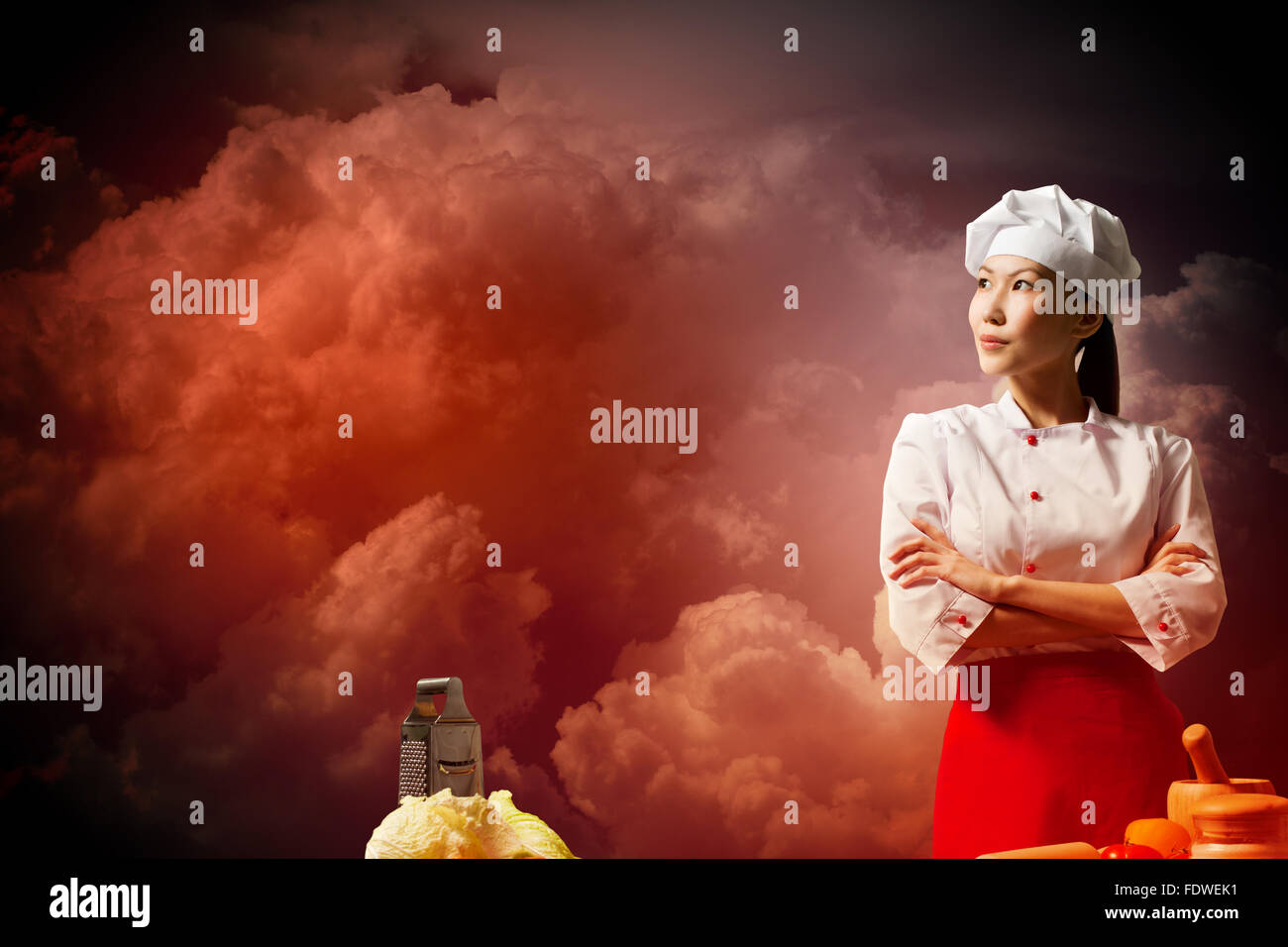 Asian female cook in anger against color background with shine effects ...