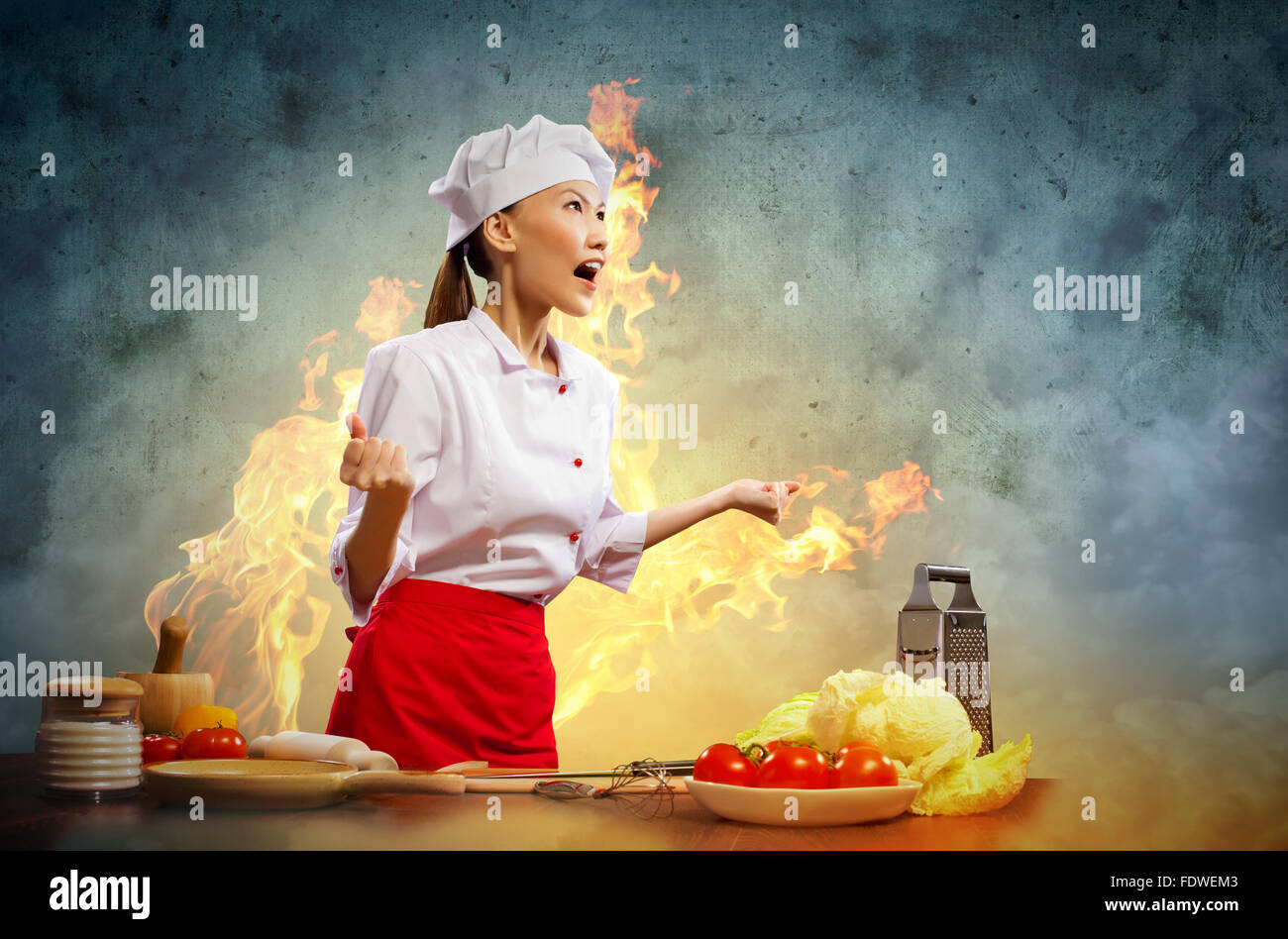 Asian female cook in anger against color background with shine effects ...