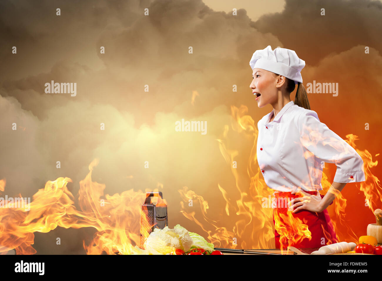 Asian female cook in anger against color background with shine effects ...