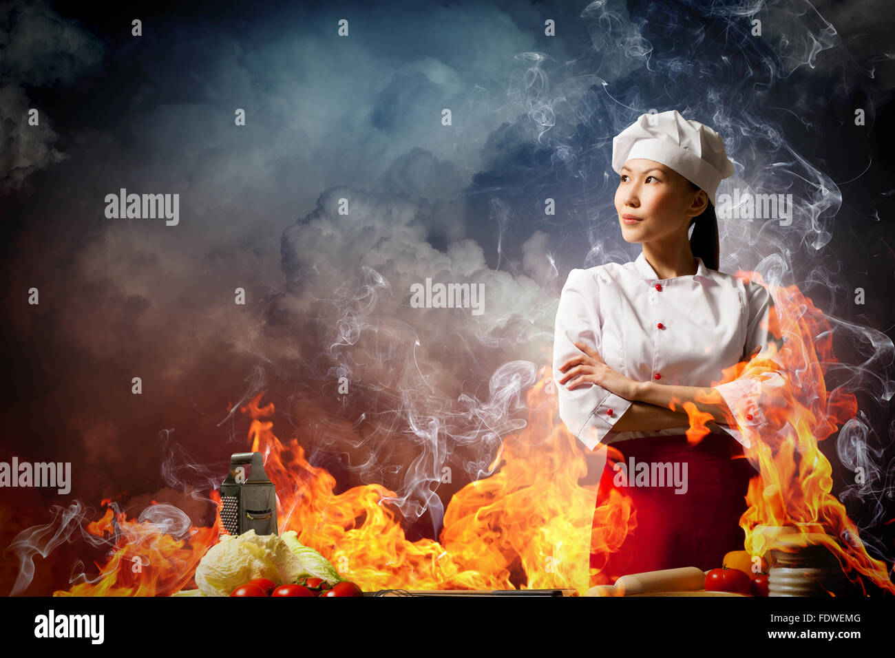 Asian female cook in anger against color background with shine effects ...