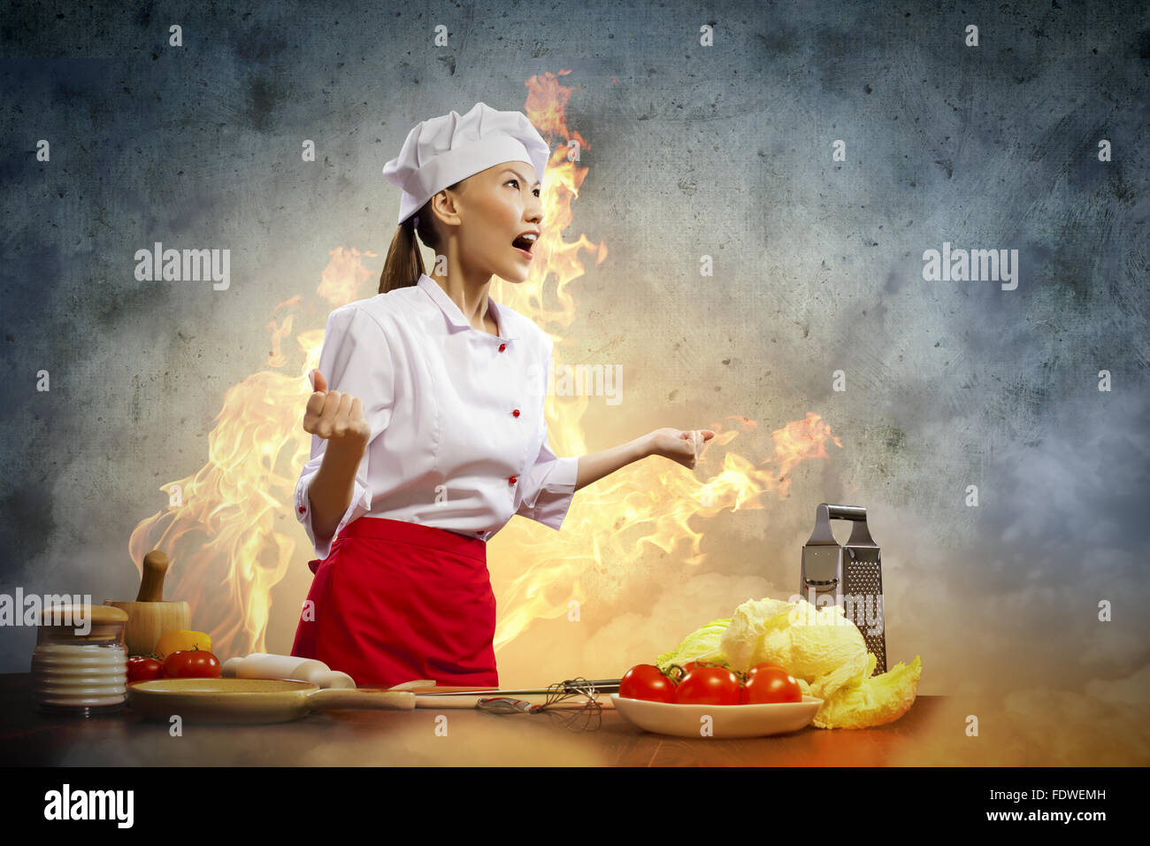 Asian female cook in anger against color background with shine effects ...