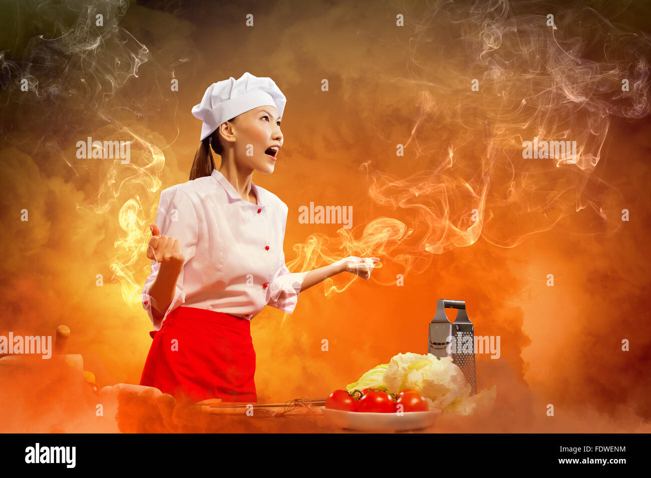 Asian female cook in anger against color background with shine effects ...