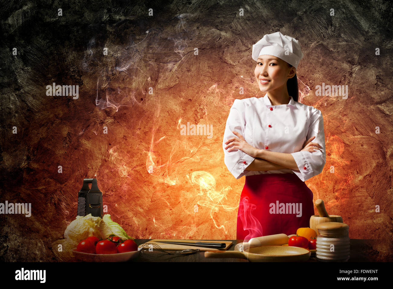 Asian female cook in anger against color background with shine effects ...