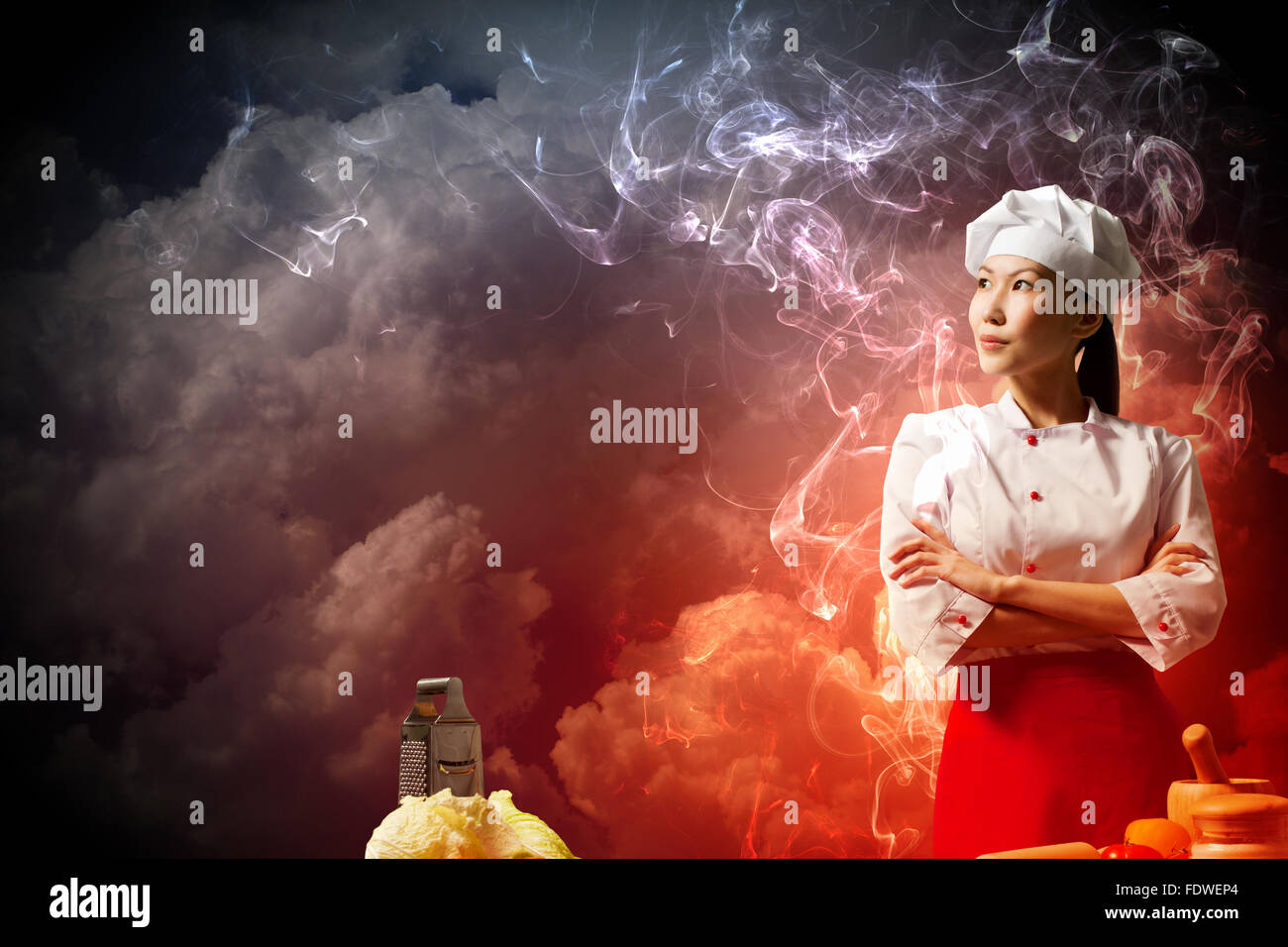 Asian female cook in anger against color background with shine effects ...
