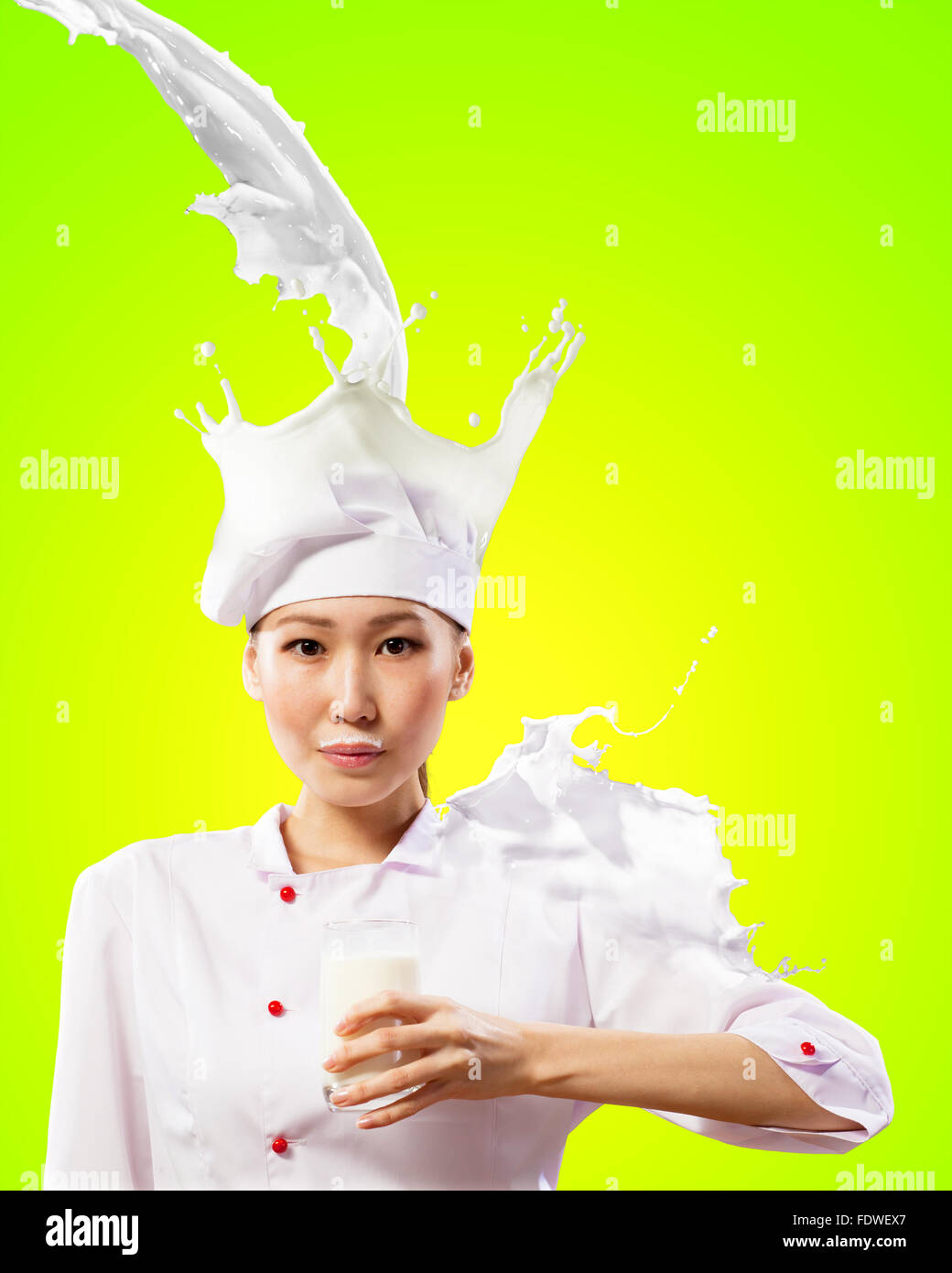 Asian female cook against milk splashes in red apron against color ...