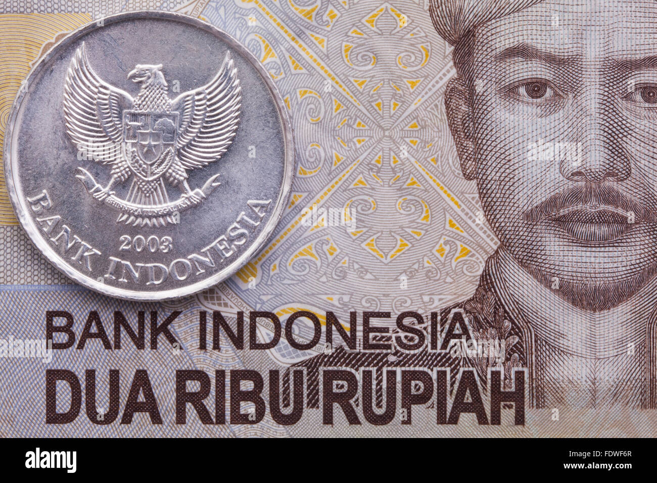 Indonesian money rupiah banknote and coins, close-up Stock Photo - Alamy