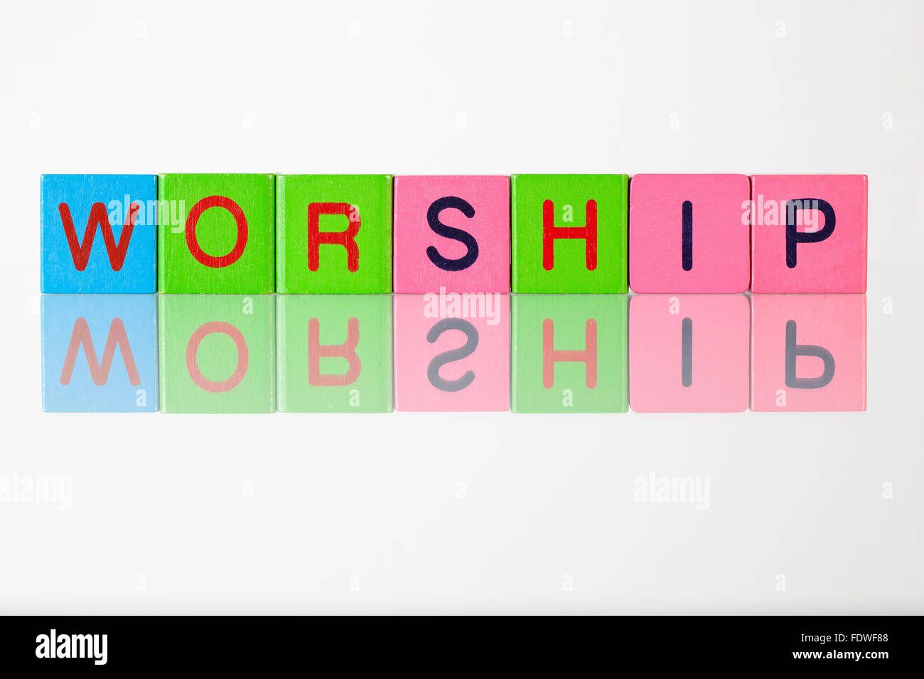 Worship - an inscription from children's wooden blocks Stock Photo - Alamy