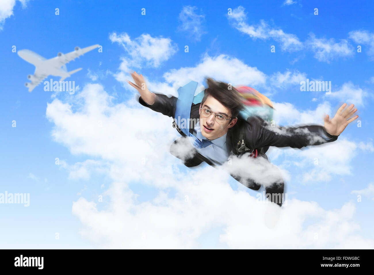 Conceptual image of young businessman flying with parachute on back ...