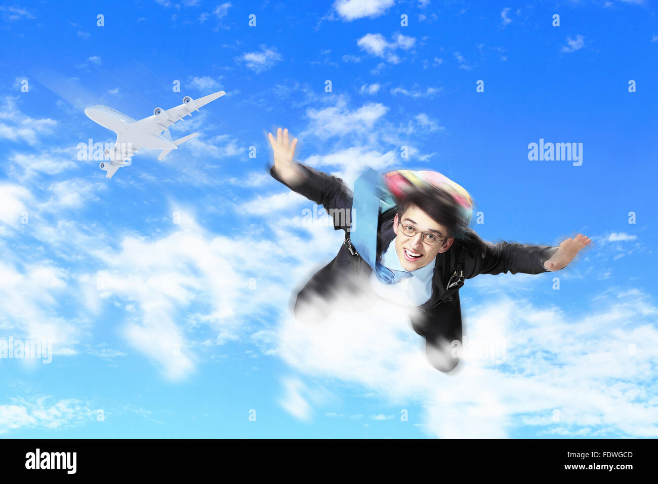 Conceptual image of young businessman flying with parachute on back ...