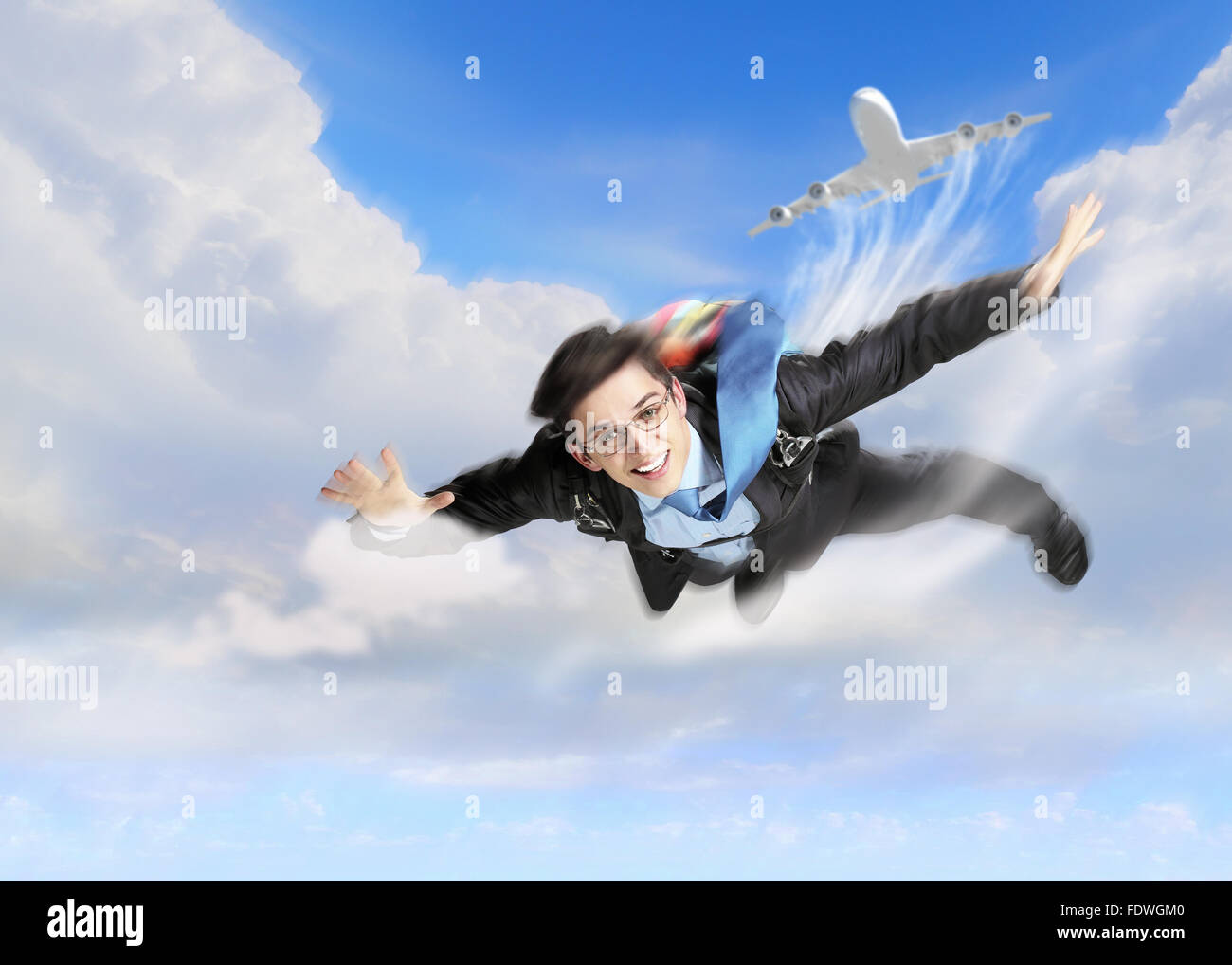 Conceptual image of young businessman flying with parachute on back ...